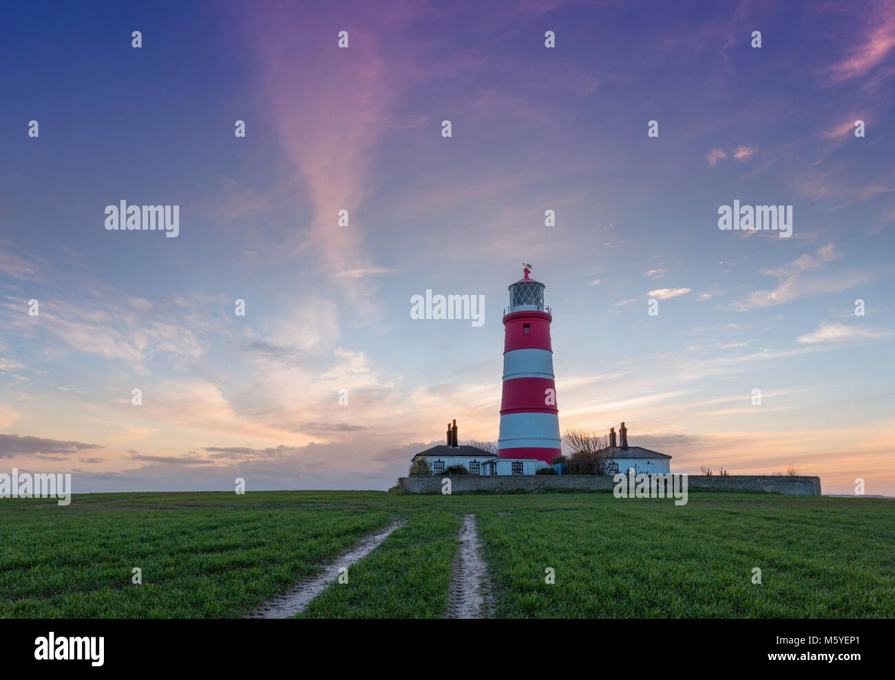 Happisburgh Lighthouse at sunset Stock Photo - Alamy