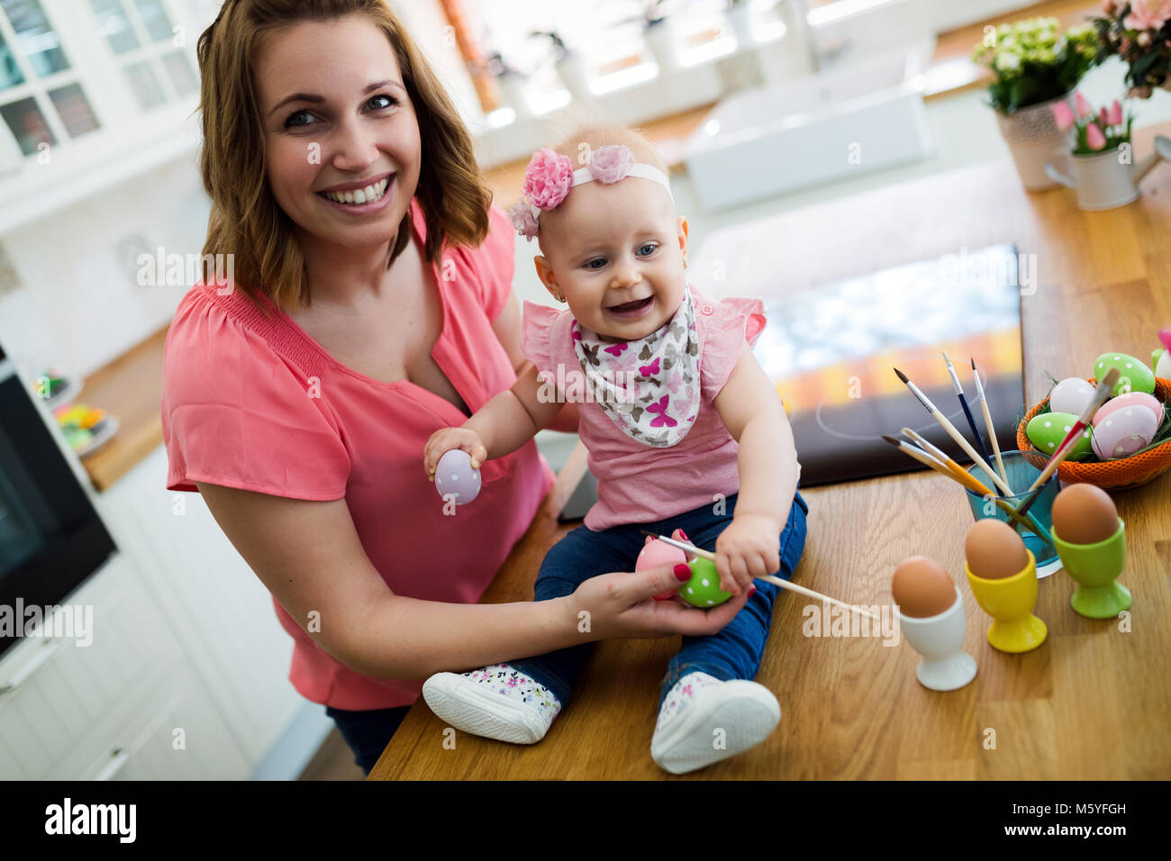 Happy family in easter time Stock Photo - Alamy