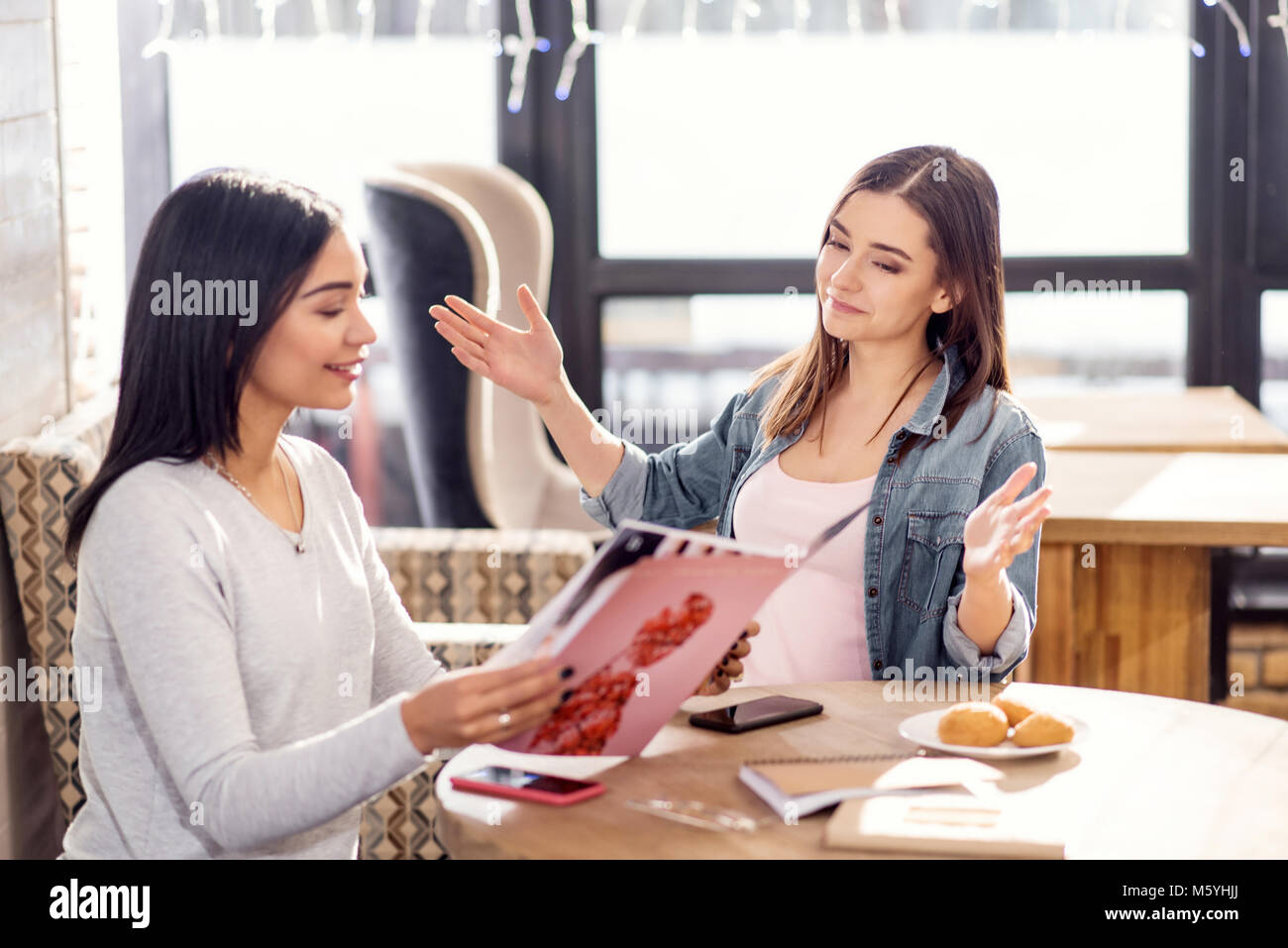 Two friends meeting in cafe hi-res stock photography and images - Alamy