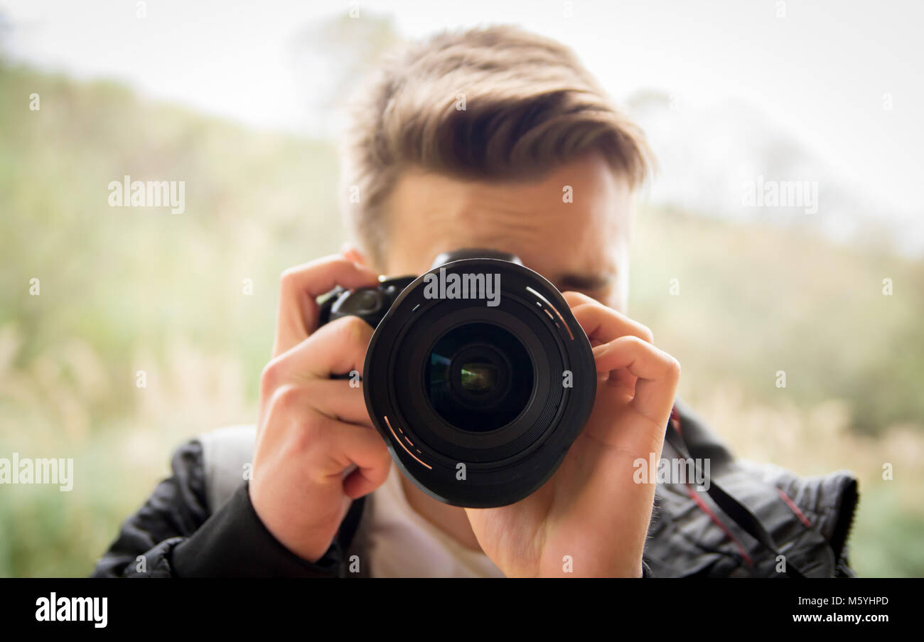 Young man making photos Stock Photo - Alamy