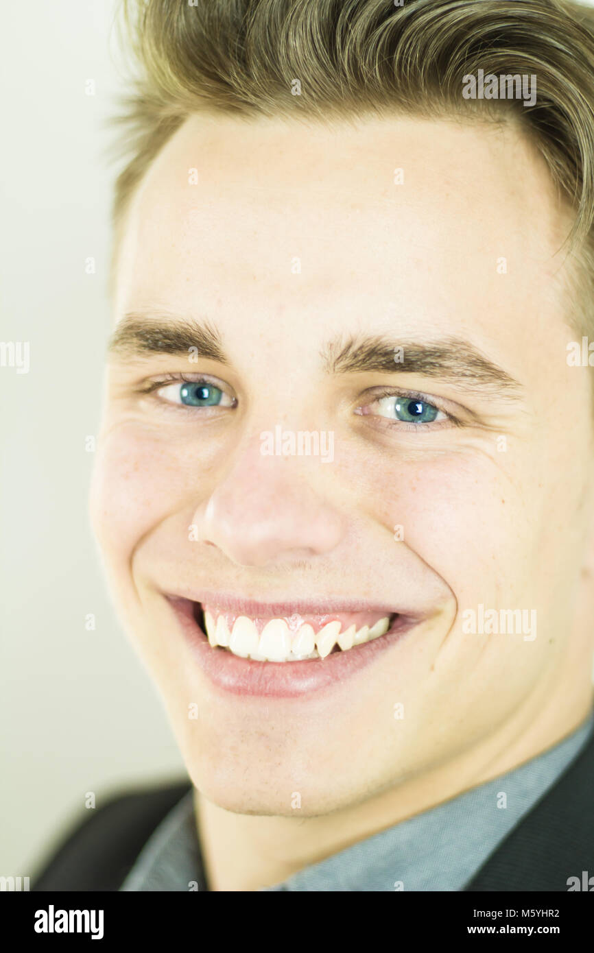 young businessman smiling Stock Photo - Alamy