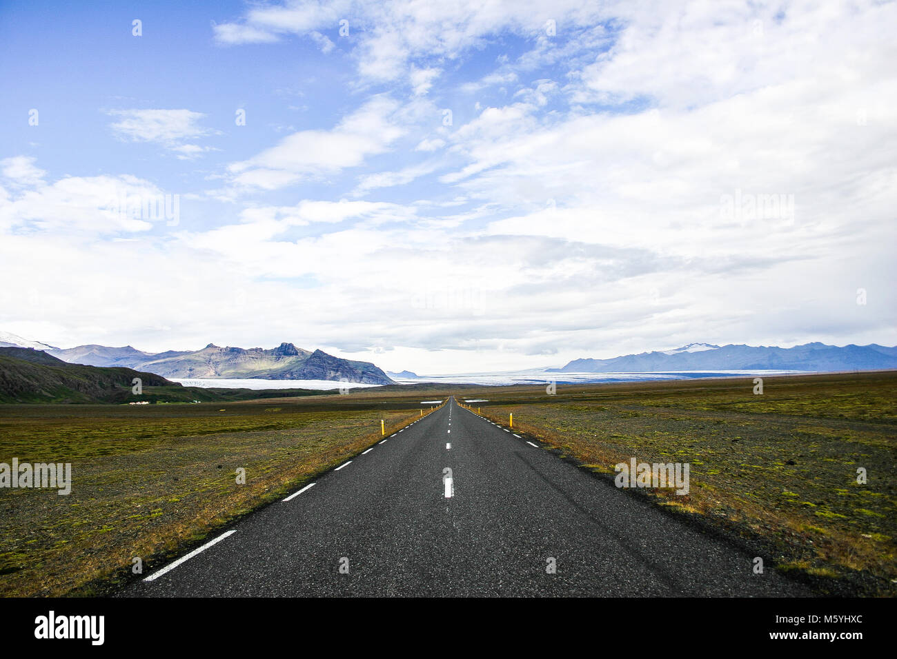 long road in green iceland Stock Photo - Alamy