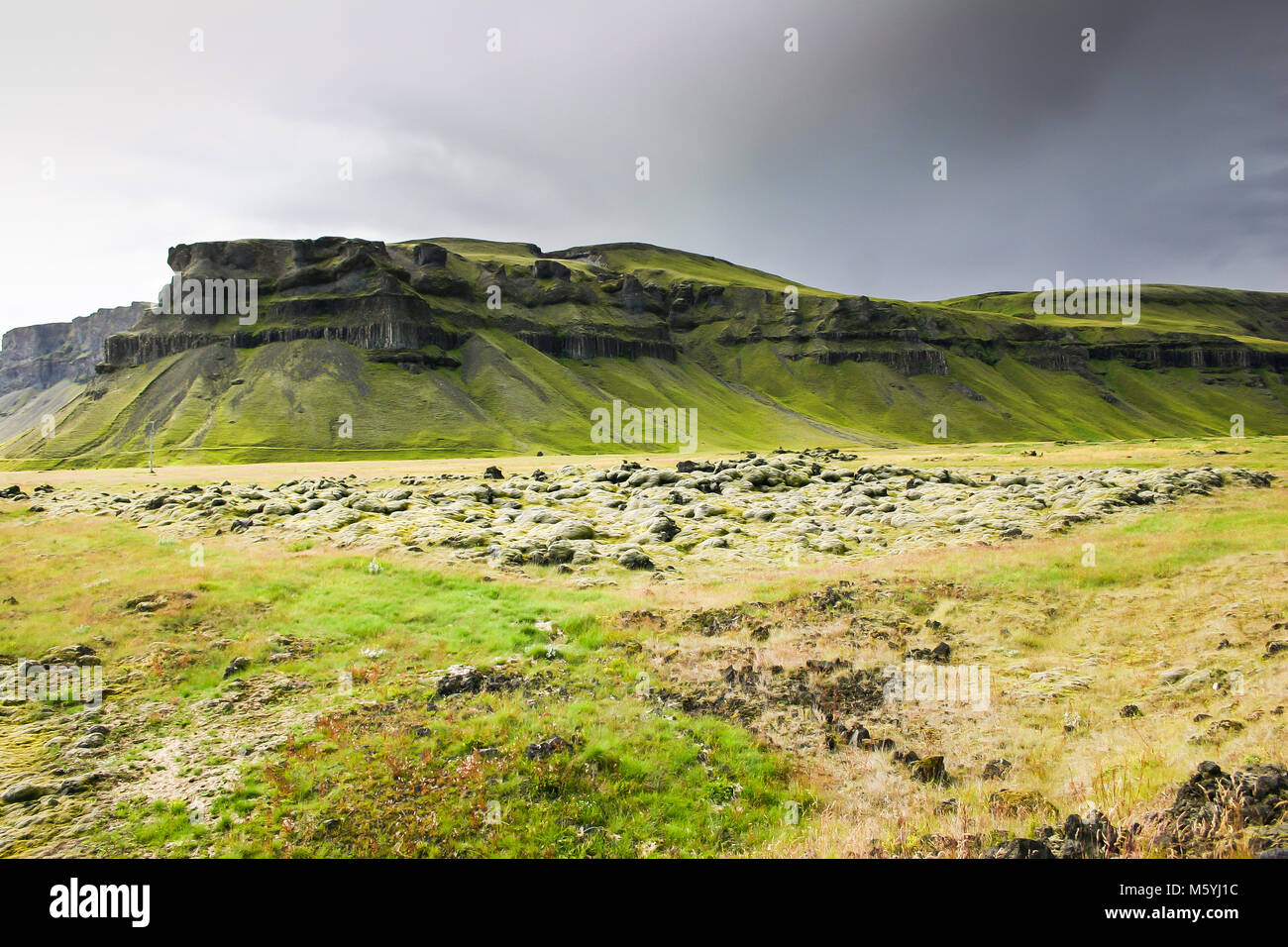 waterfall in green iceland landscape Stock Photo - Alamy
