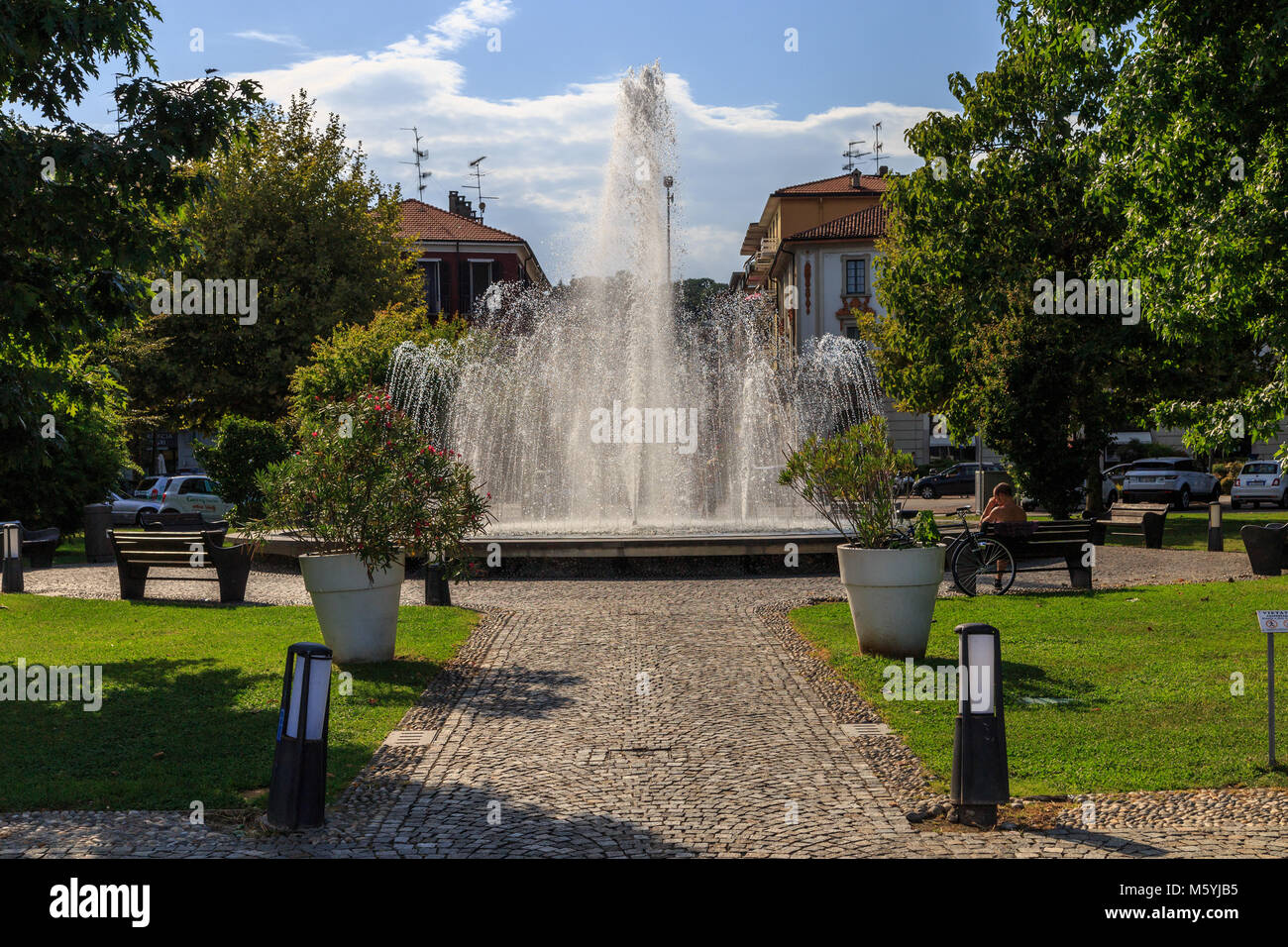 town fountain, front view with meadow Stock Photo - Alamy