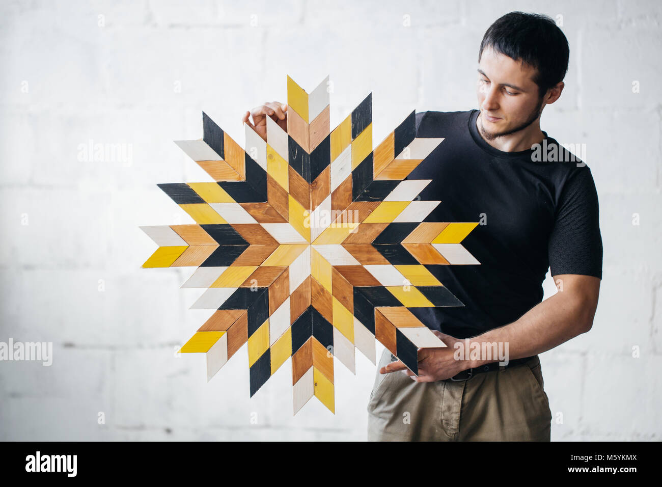 carpenter standing with a wood product and looking at camera Stock ...