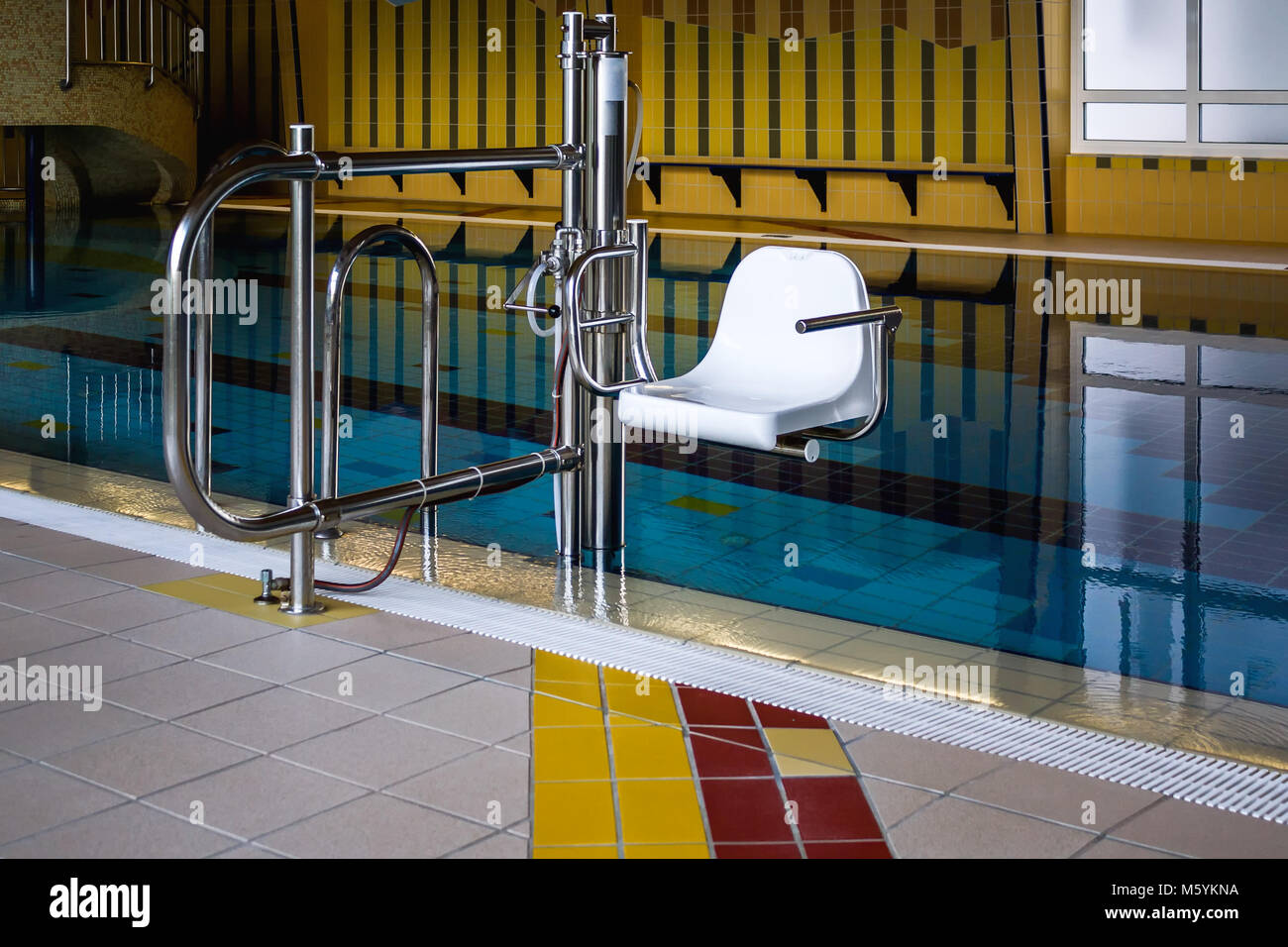 MALLNITZ, AUSTRIA - FEBRUARY 6, 2018: Swimming pool lift for disabled ...