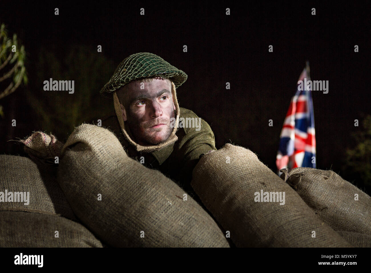 World War Two soldier on the battlefield at night Stock Photo - Alamy