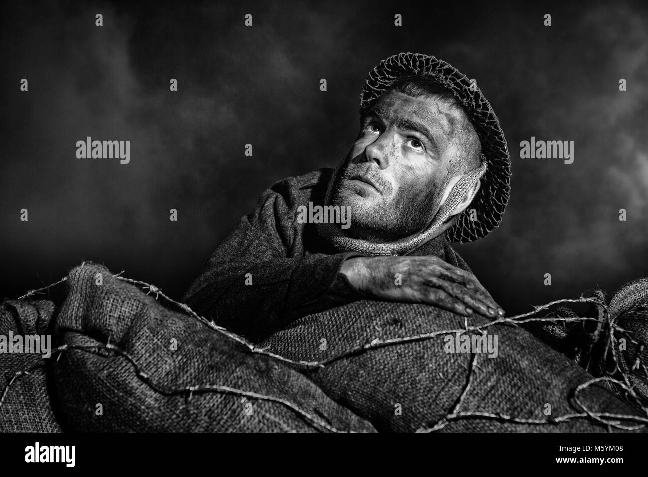 World War Two soldier in authentic battlefield tunic and ww2 helmet in ...