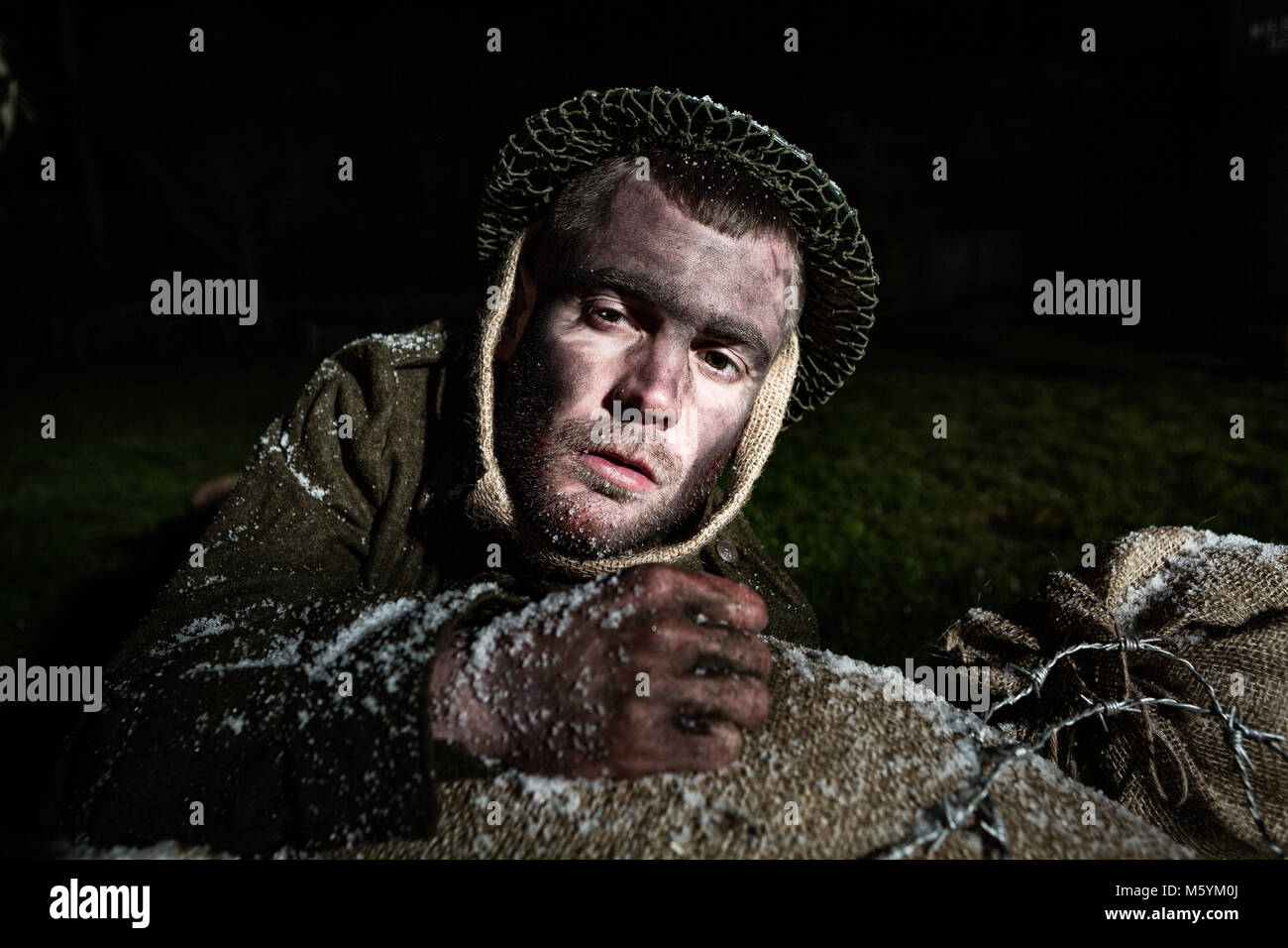 World War Two soldier in authentic battlefield tunic and ww2 helmet in ...