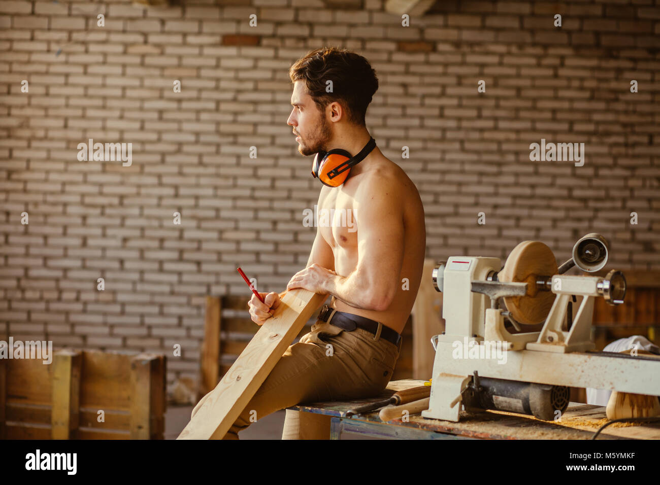 Carpenter hand using pencil draw hi-res stock photography and images ...