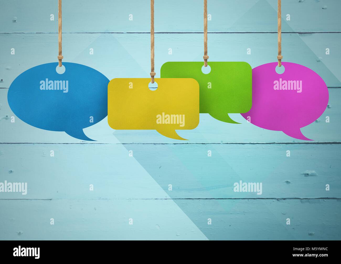 Hanging paper speech bubbles and wood background Stock Photo - Alamy