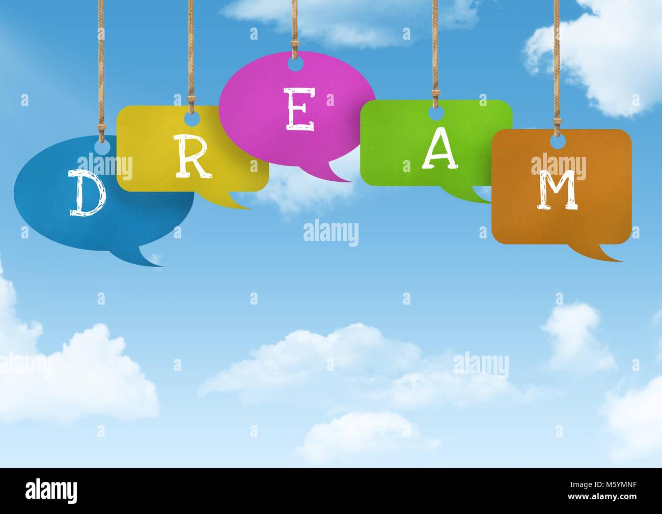 Dream text on hanging paper speech bubbles Stock Photo - Alamy