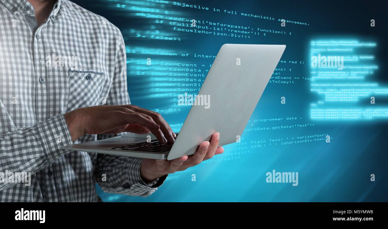 Man typing coding text on laptop Stock Photo - Alamy
