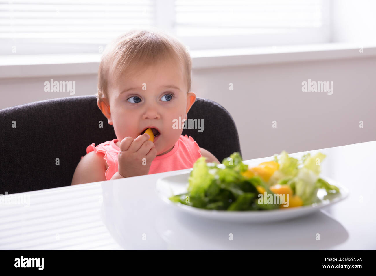 Close-up Of A Baby Girl Eating Healthy Food At Breakfast Stock Photo ...