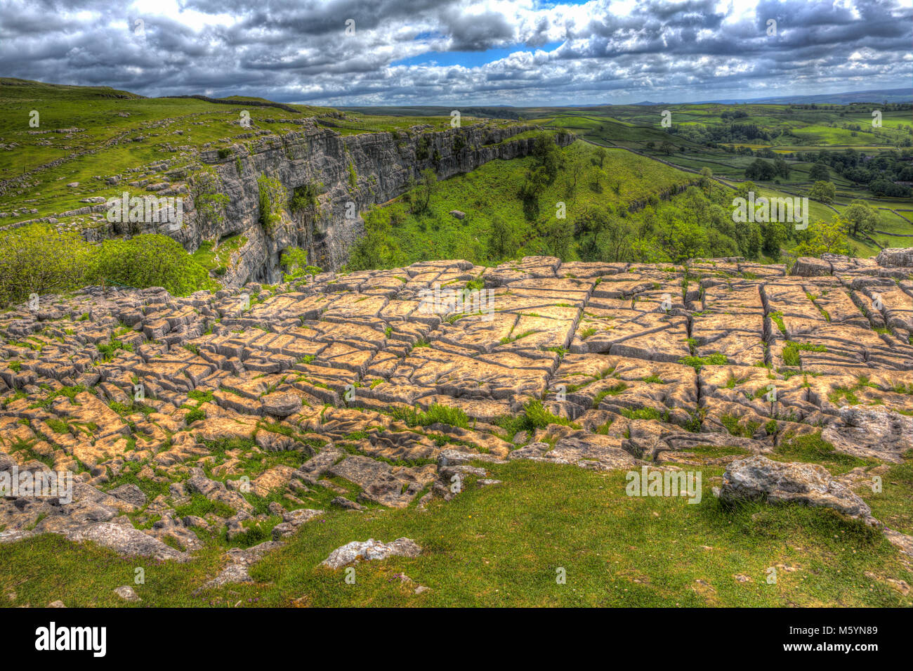 Rocky top of Malham Cove Yorkshire Dales UK popular tourist attraction ...