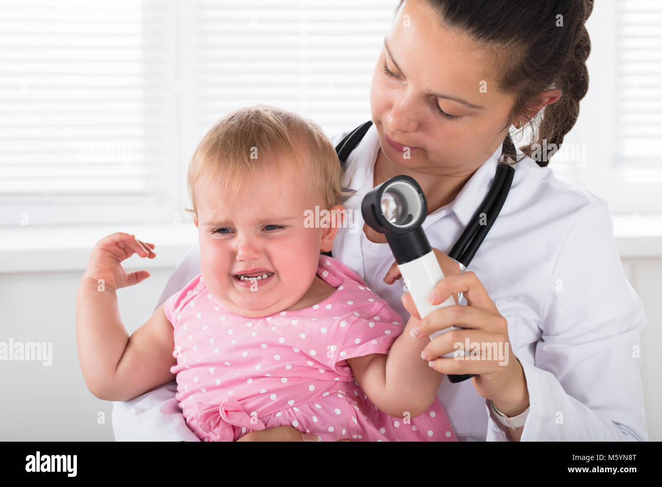 Doctor examination crying hi-res stock photography and images - Alamy