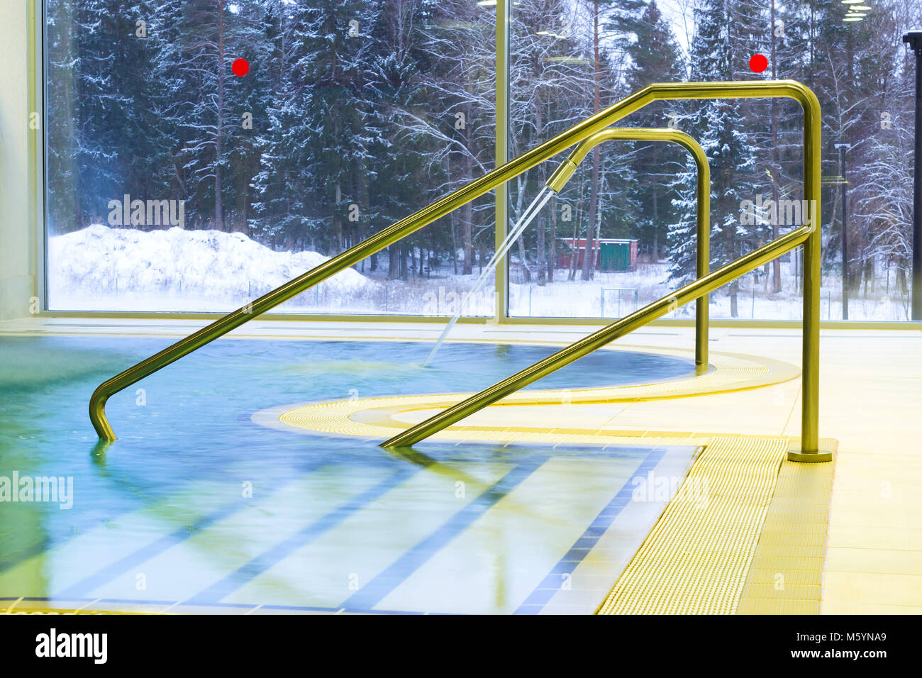 Water massage, stream of clear blue water under pressure flows into ...