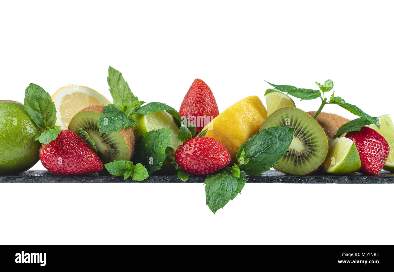 Different juicy fruits and mint leaves , isolated on white background ...