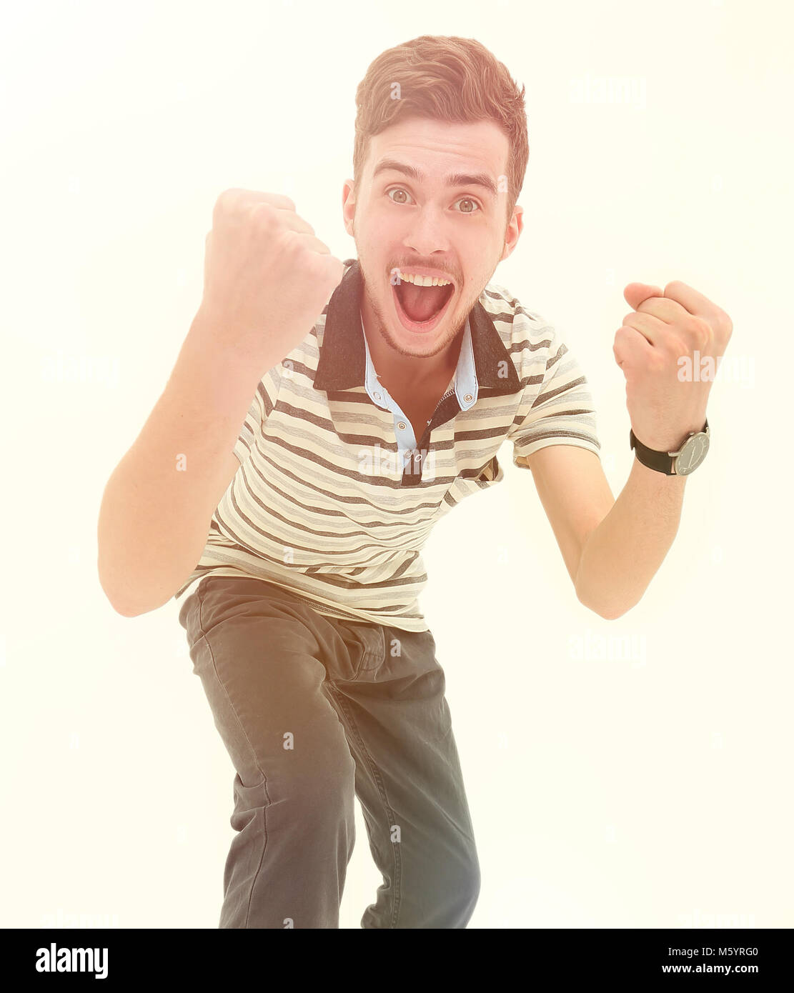 closeup. happy guy celebrating his success Stock Photo - Alamy