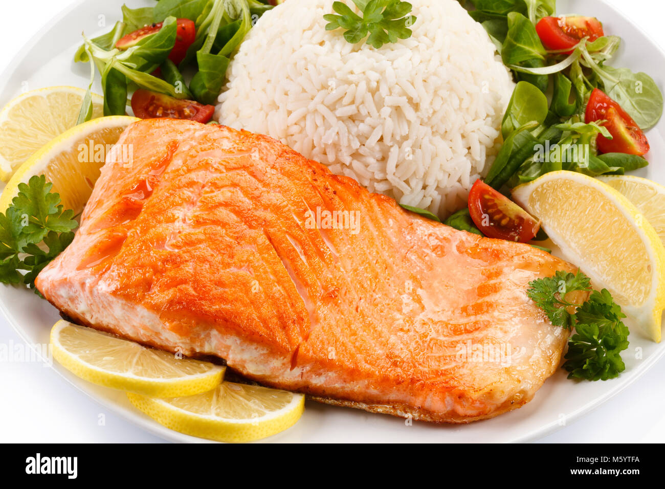 Roasted salmon, rice and vegetables on white background Stock Photo - Alamy