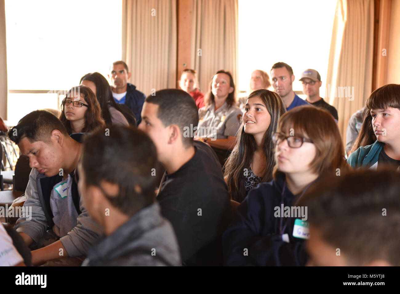 Students listen to speakers Stock Photo - Alamy