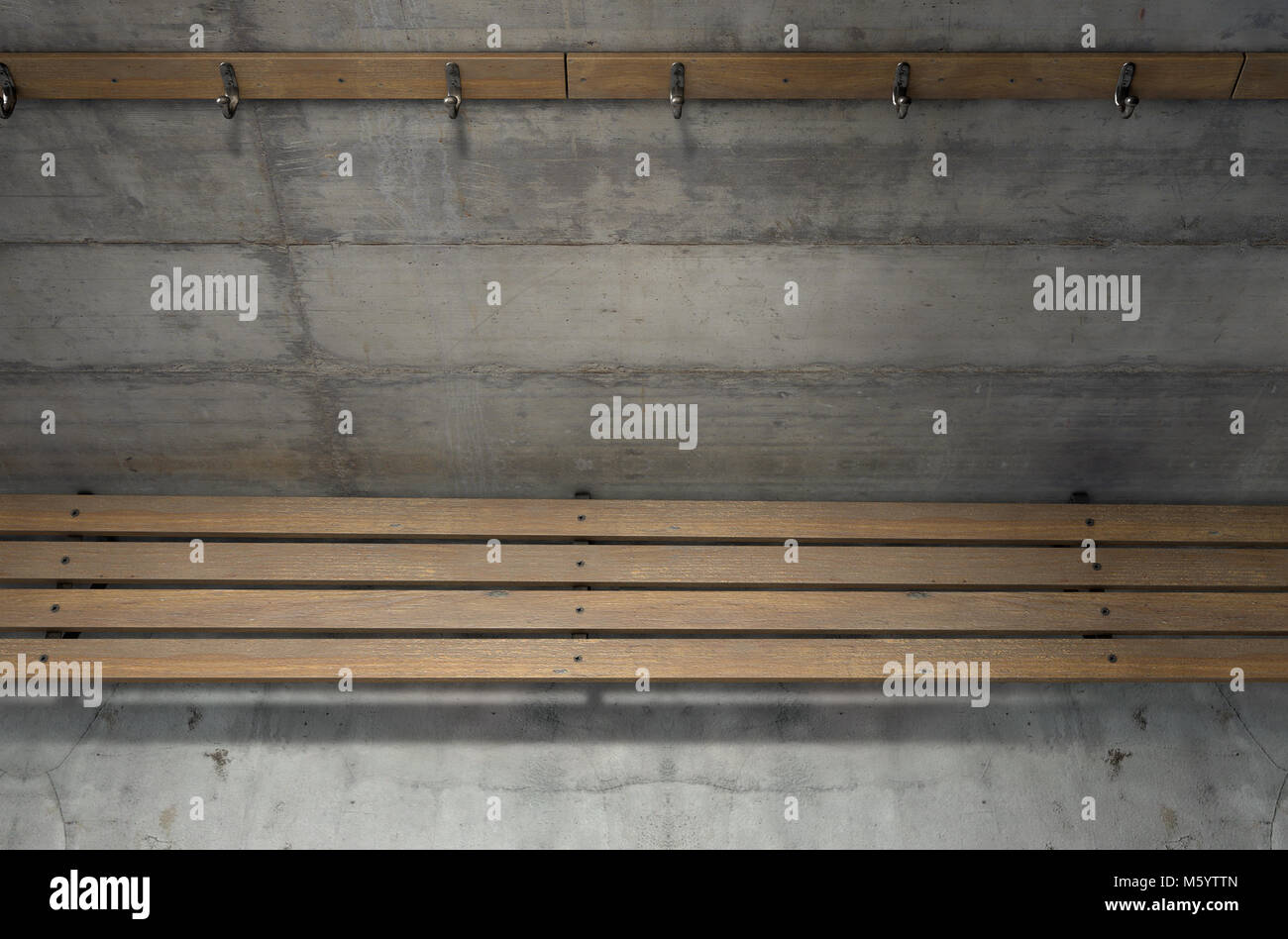 An empty clothes hanging rack above an empty wooden bench against a ...