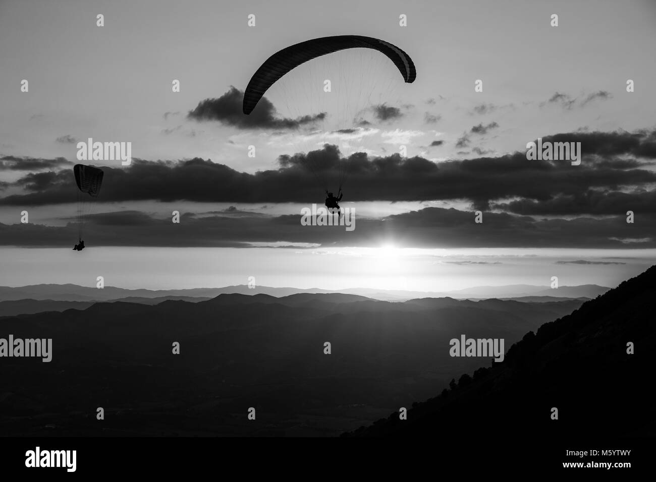 Flying over clouds sunset sun Black and White Stock Photos & Images - Alamy