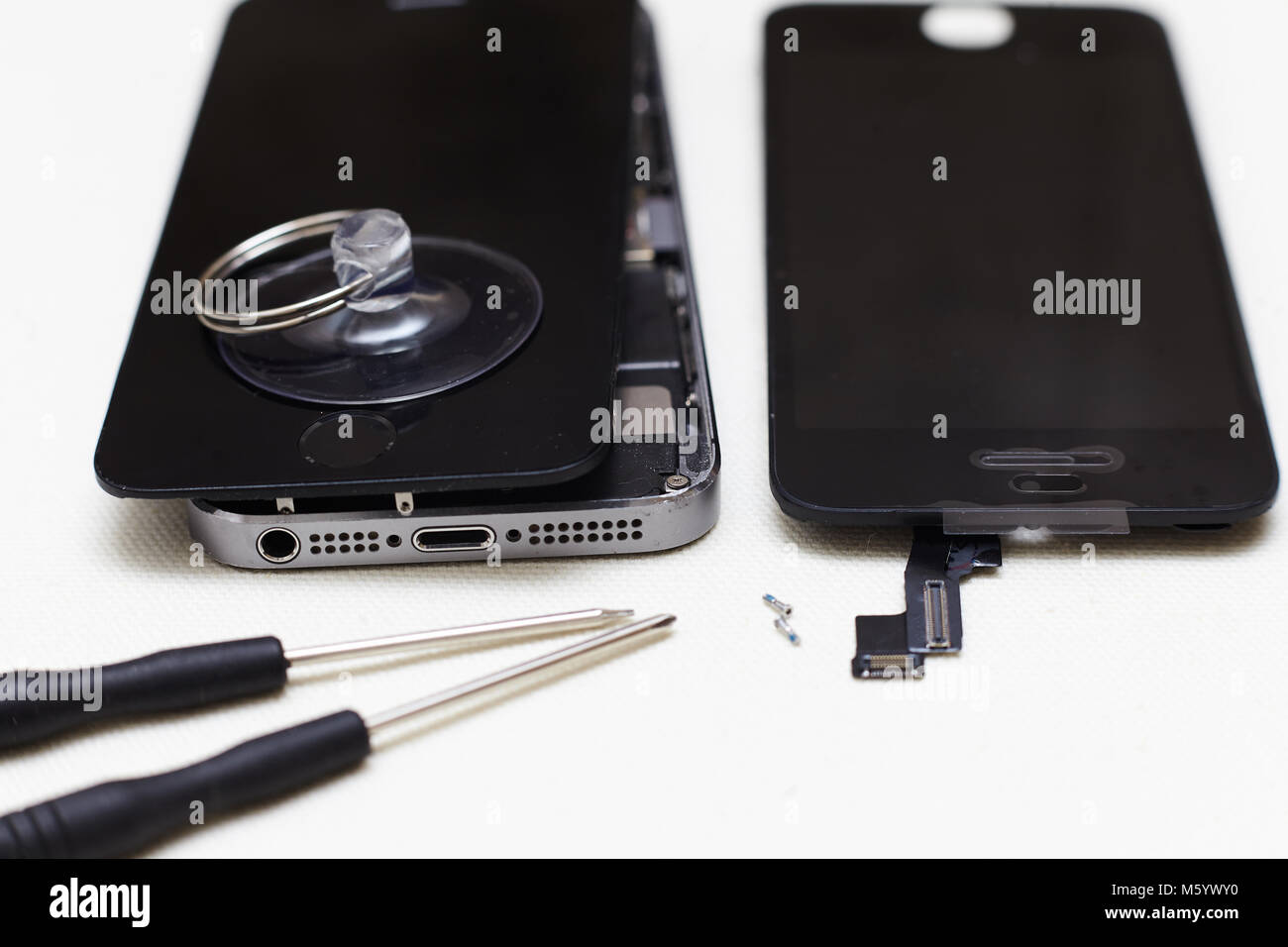 Close-up photos showing process of mobile phone repair, changing the ...