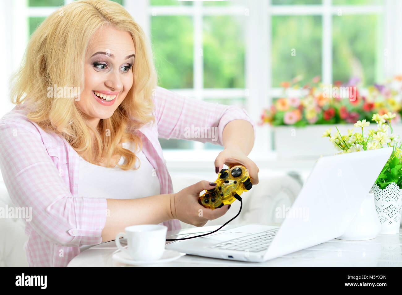woman playing computer game Stock Photo - Alamy