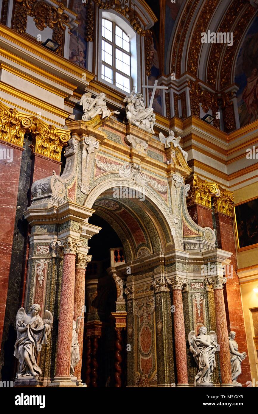 Elaborate archway surrounded by statues of angels inside St Pauls ...