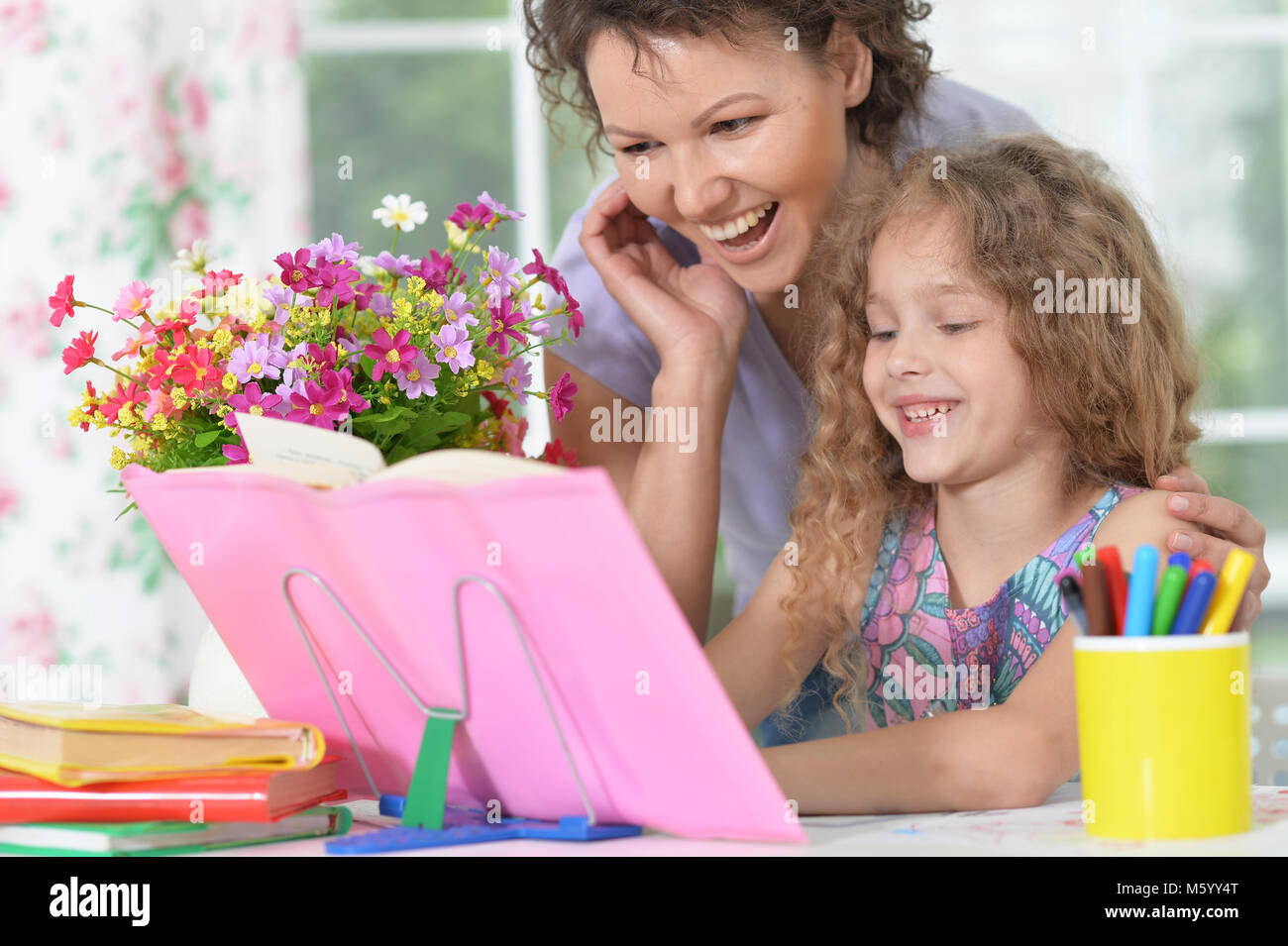 Doing homework with mom hi-res stock photography and images - Alamy