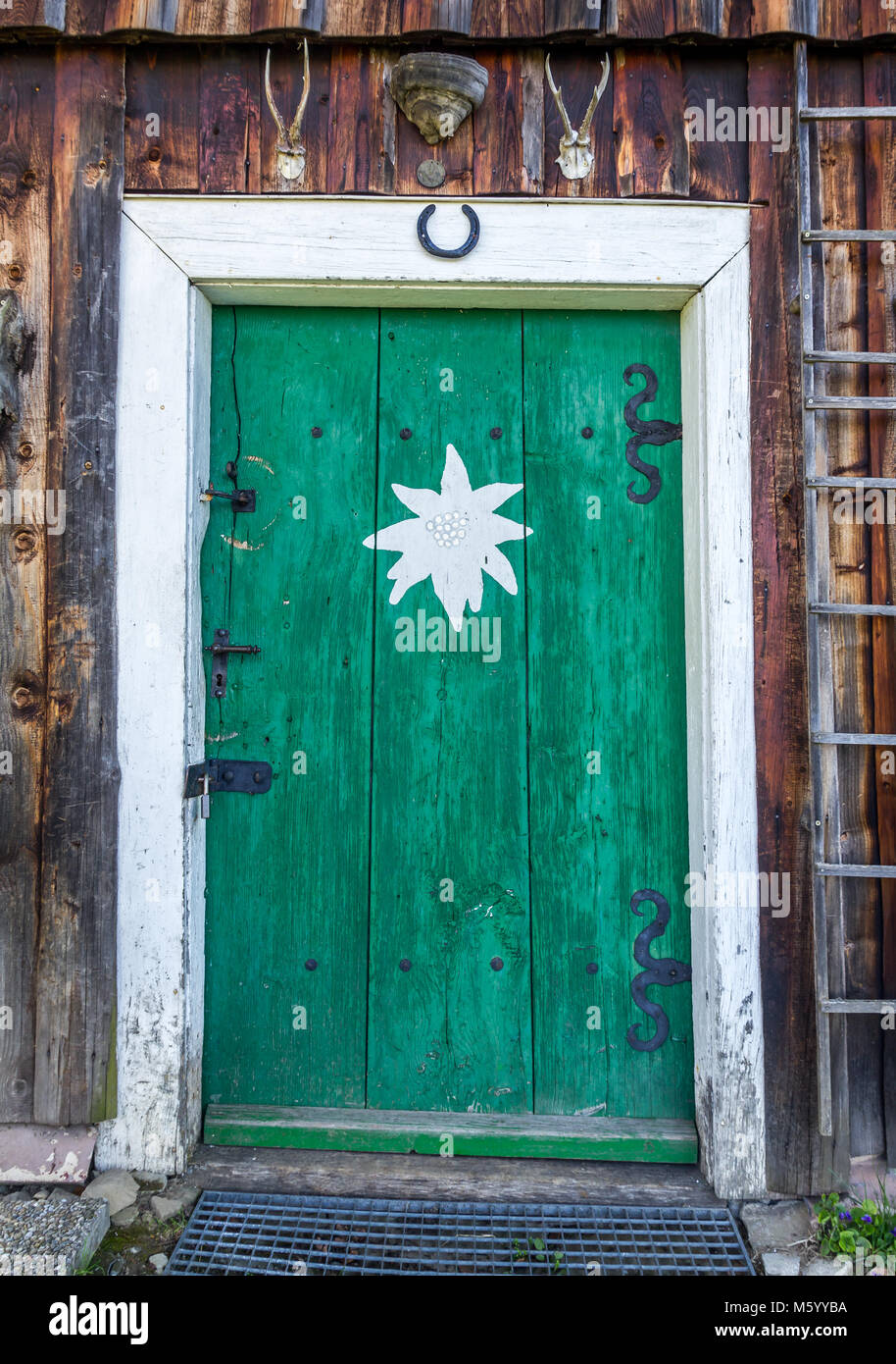 Old fashioned door of mountain hut in the Alps Stock Photo - Alamy