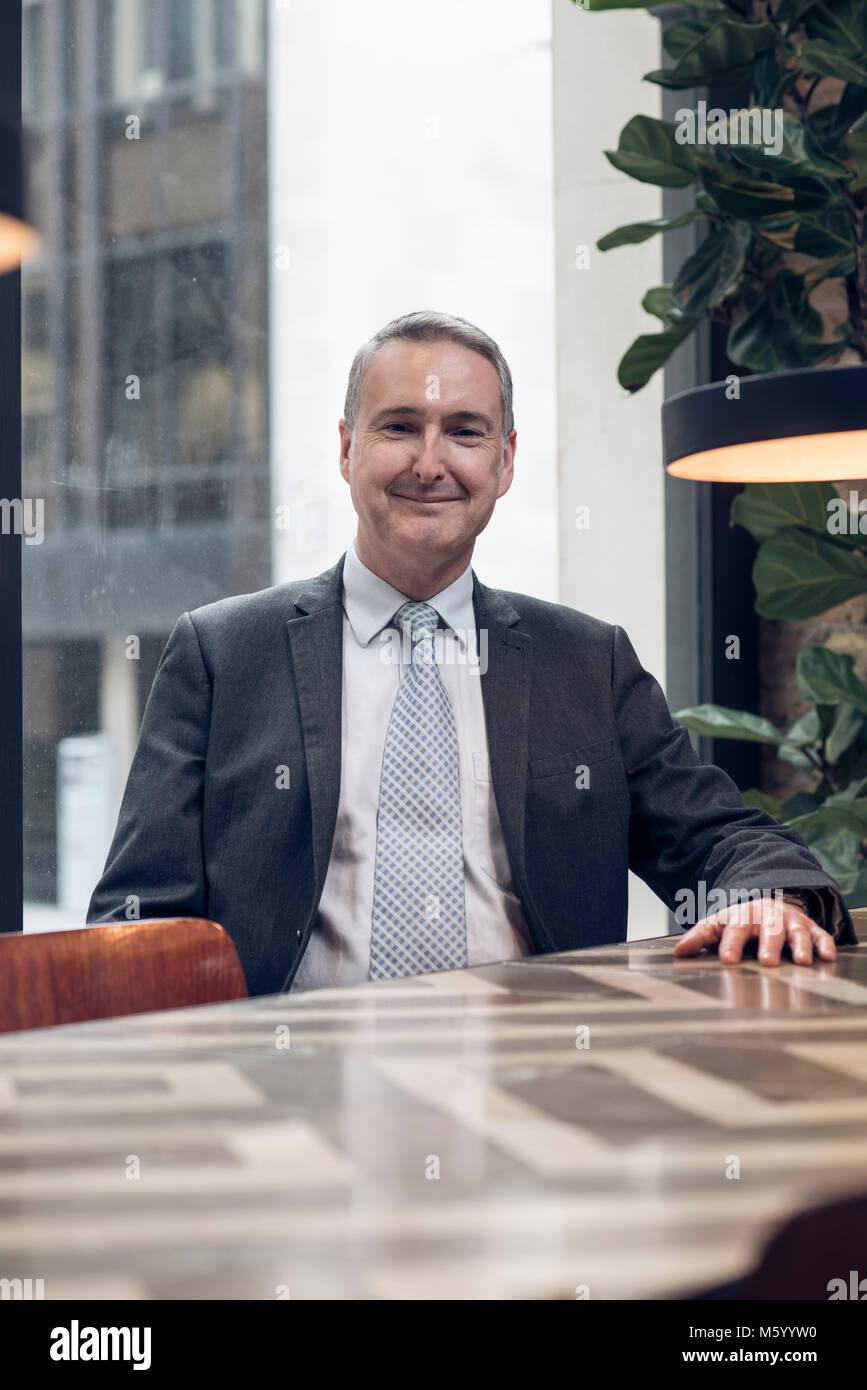 real management team profile photo taken in a designed relaxed cafe ...