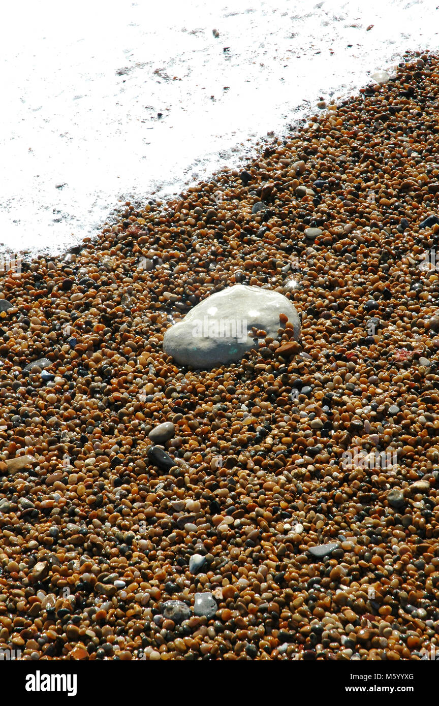 Pebbles scattered on beach hi-res stock photography and images - Alamy