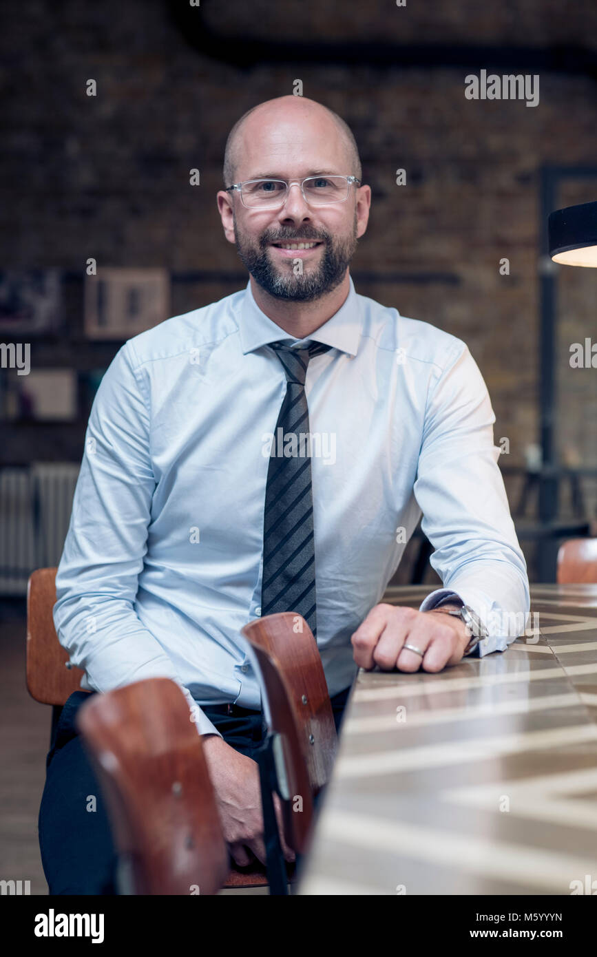 real management team profile photo taken in a designed relaxed cafe ...