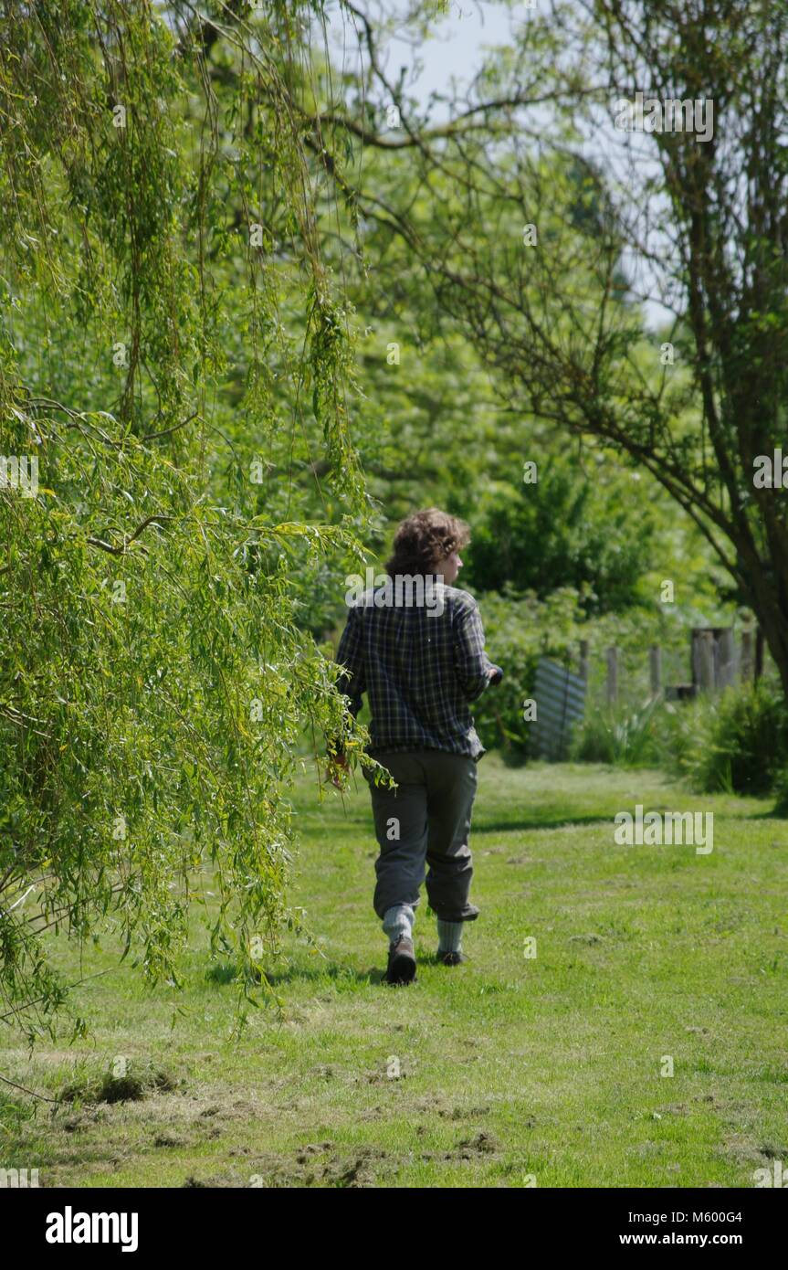 Young Handsome Nature Photographer Strolling Along a Grassy Vibrant ...