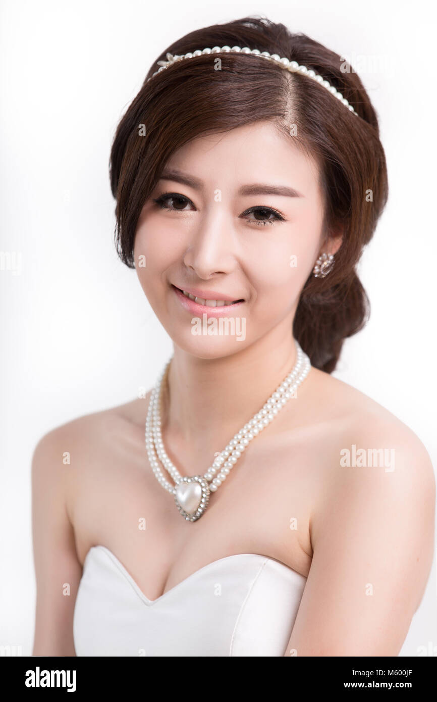 An Asian bride, studio shot white background Stock Photo - Alamy