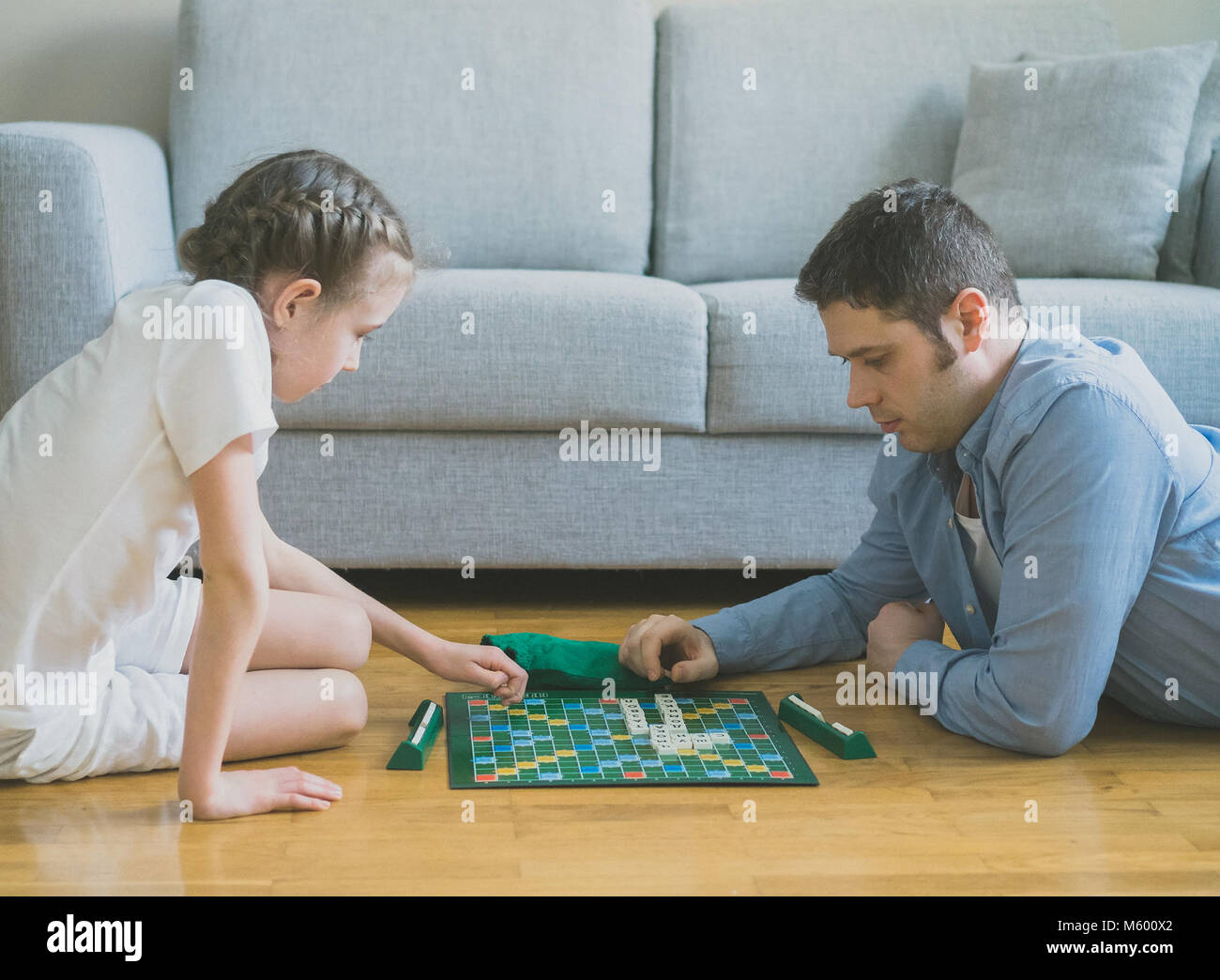 Family playing scrabble hi-res stock photography and images - Alamy