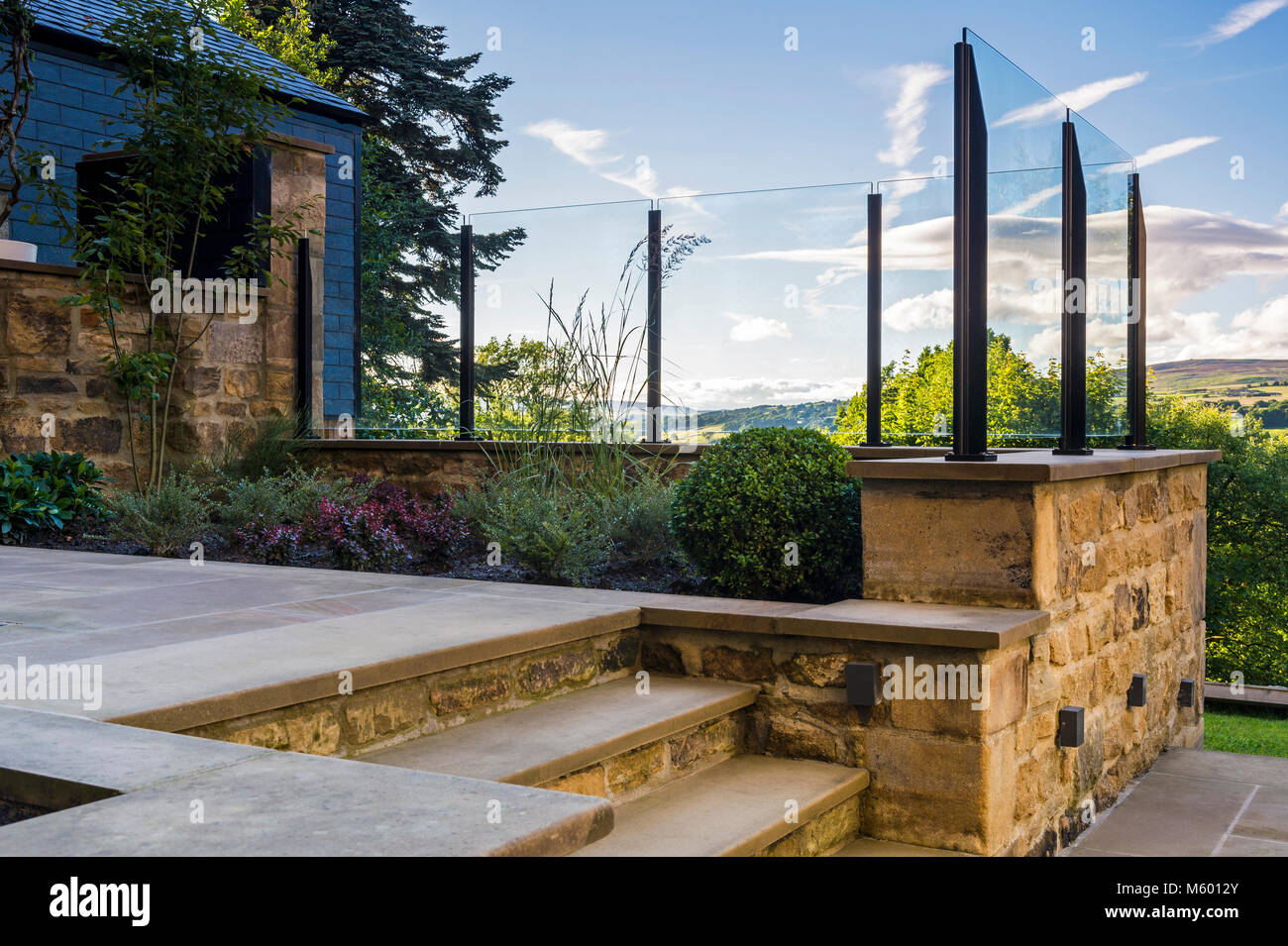 Glazed glass balustrade windbreak screen around terrace hi-res stock ...