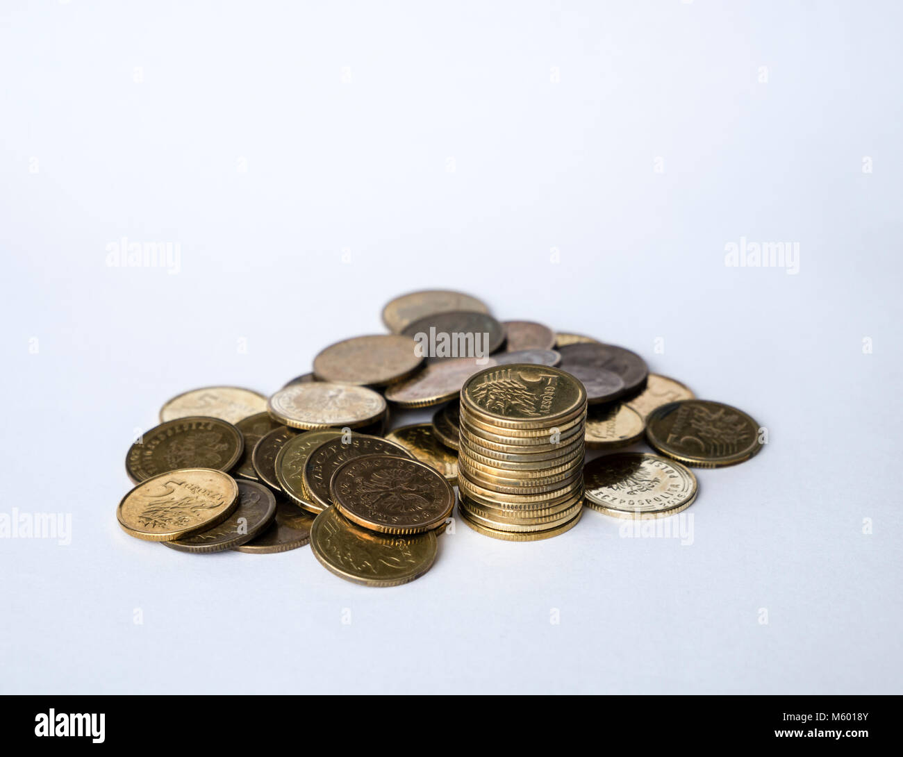 Pile of copper coins against white background Stock Photo - Alamy