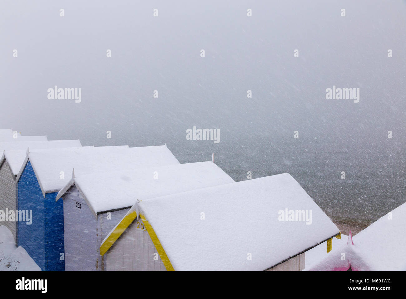 Snow Covered Beach Huts on a Snowy Thames Estuary at Thorpe Bay near ...