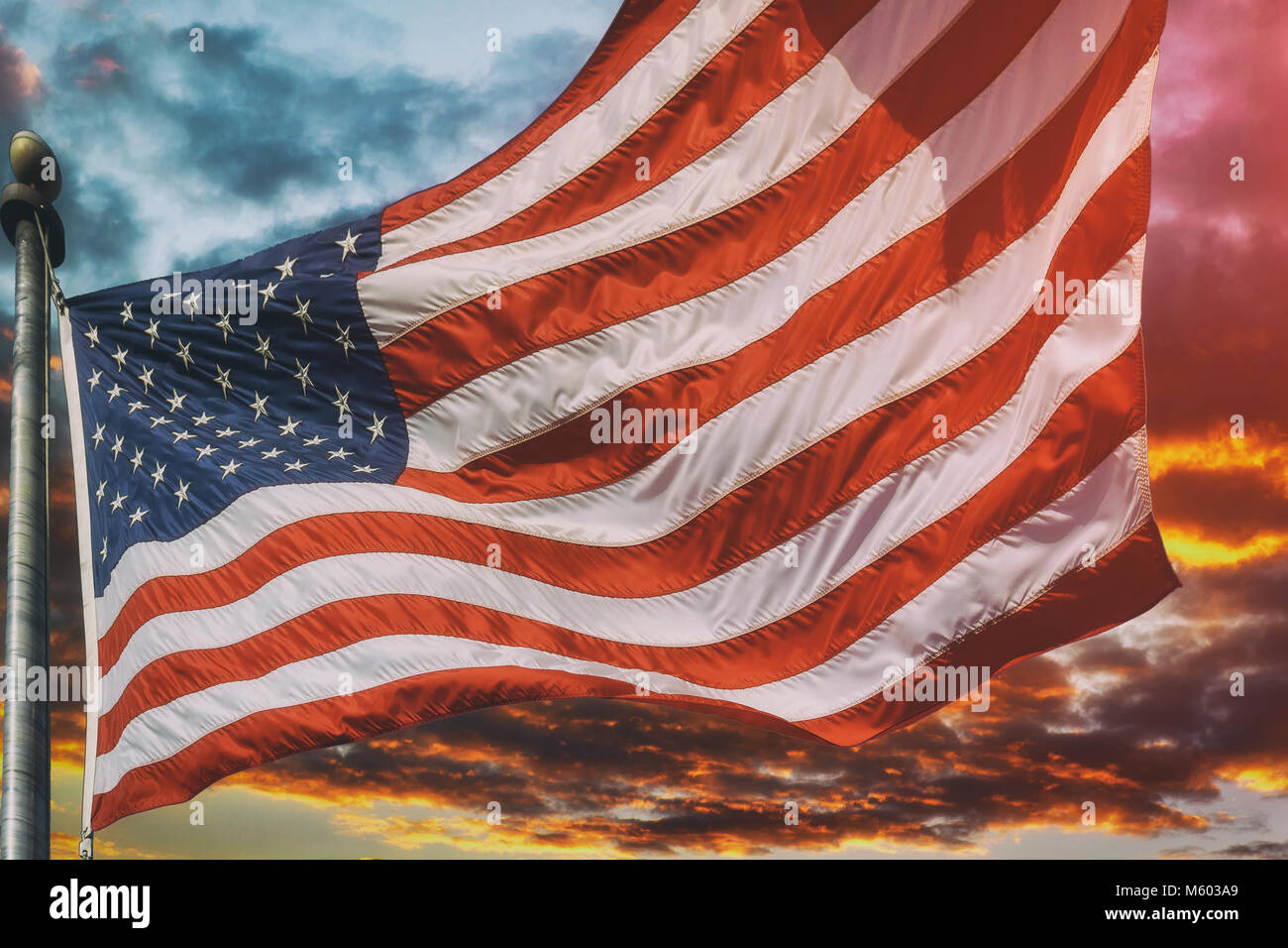 American flag flying, flag USA over beautiful Sunset sunrise with ...