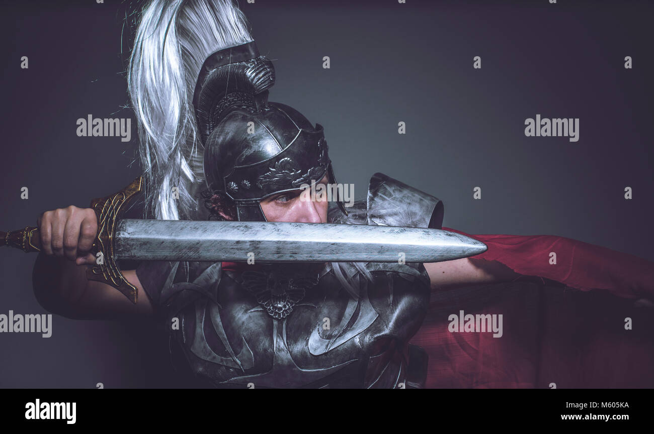 Roman gladiator, wrestler and warrior of Rome with helmet and red cloak ...