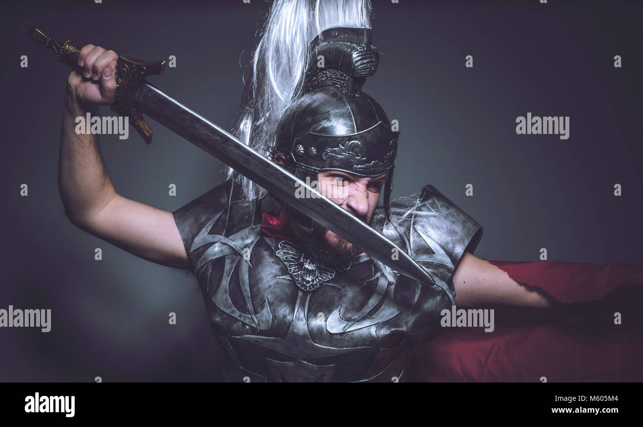 Roman gladiator, wrestler and warrior of Rome with helmet and red cloak ...