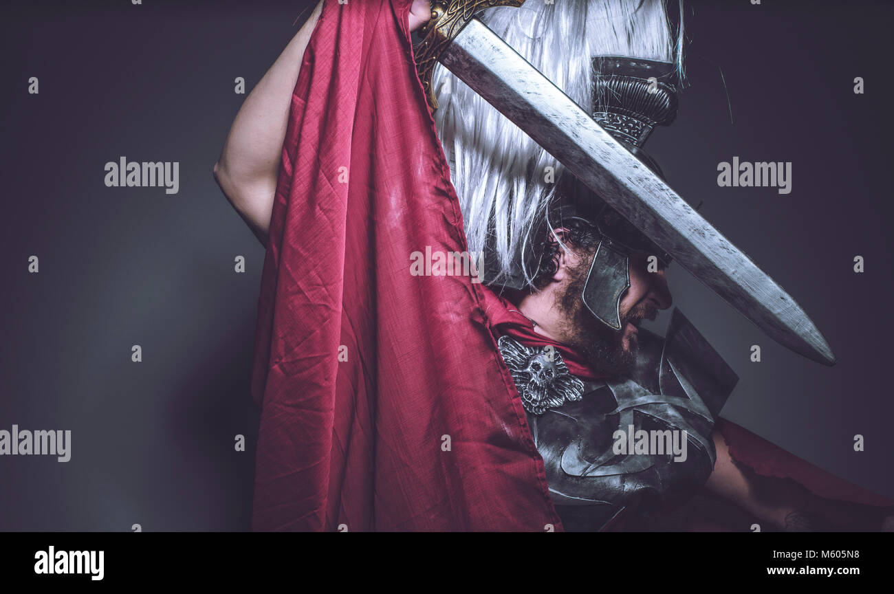 Roman gladiator, wrestler and warrior of Rome with helmet and red cloak ...