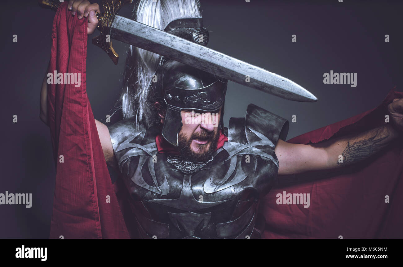 Roman gladiator, wrestler and warrior of Rome with helmet and red cloak ...