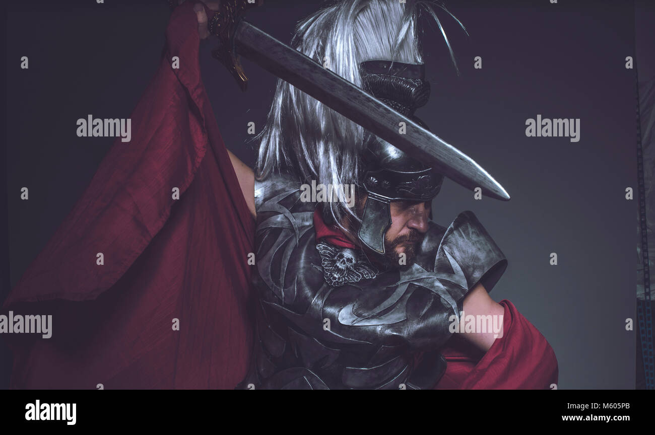 Roman gladiator, wrestler and warrior of Rome with helmet and red cloak ...