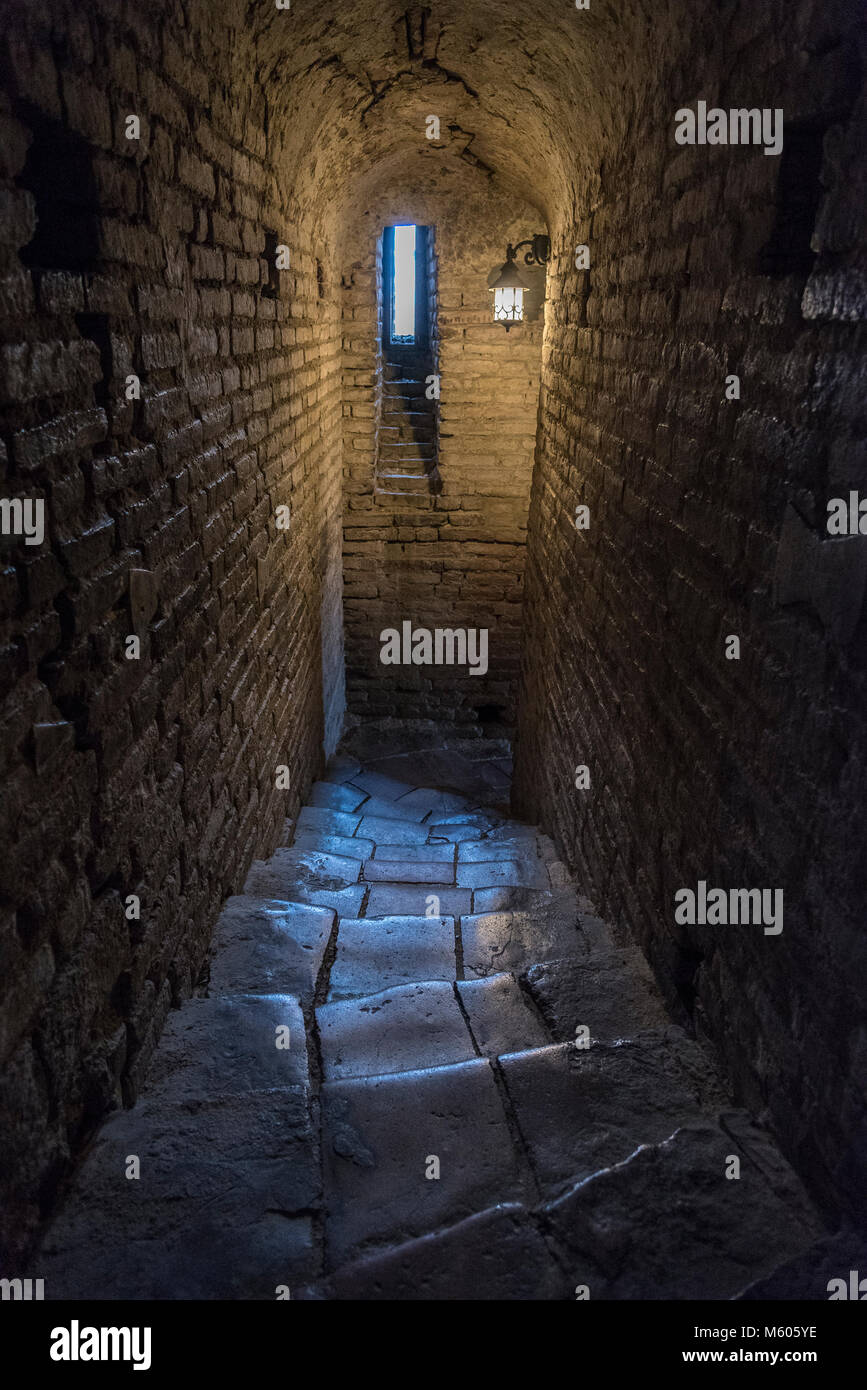 Stone interior with window of an old steeple crypt, located inside an ...