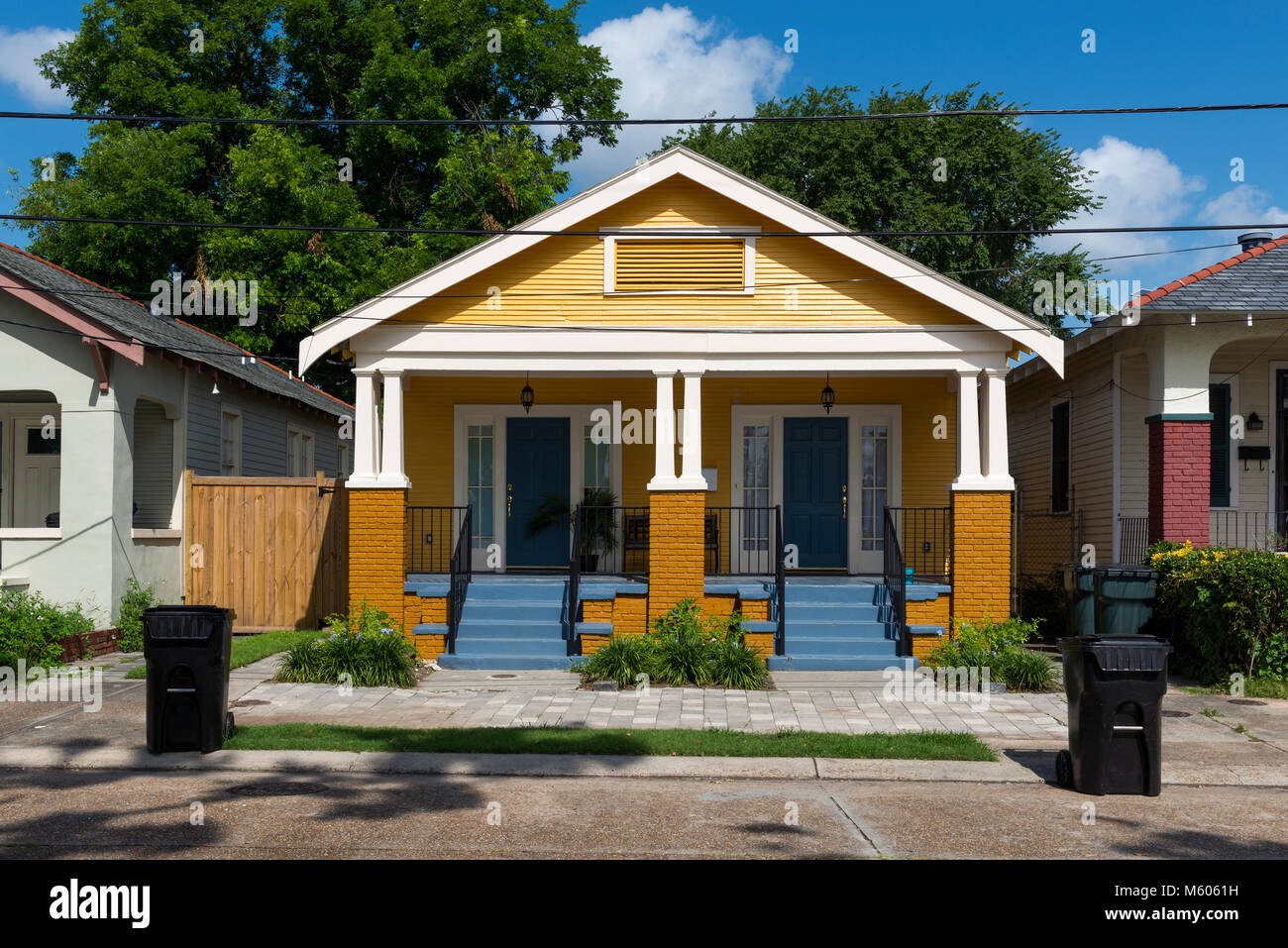 The facade of a traditional colorful house in the Marigny neighborhood ...