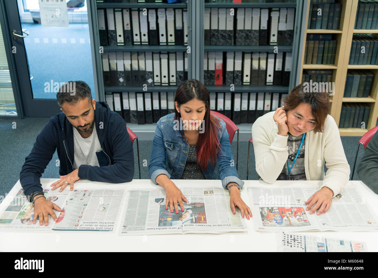 Student reading newspaper classroom hi-res stock photography and images ...